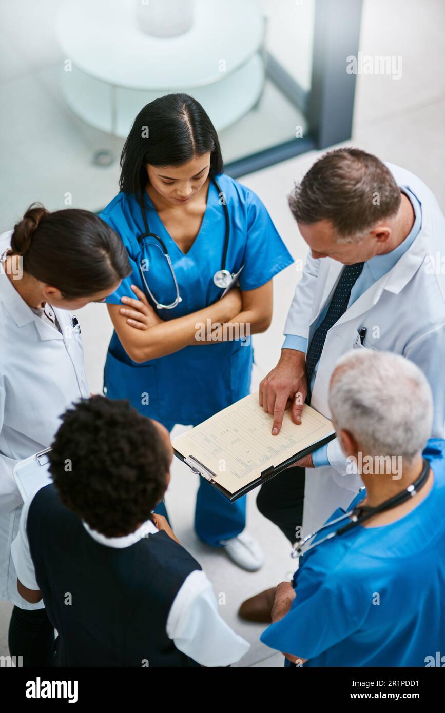 Teamwork, clipboard and medical with doctors in hospital for consulting ...