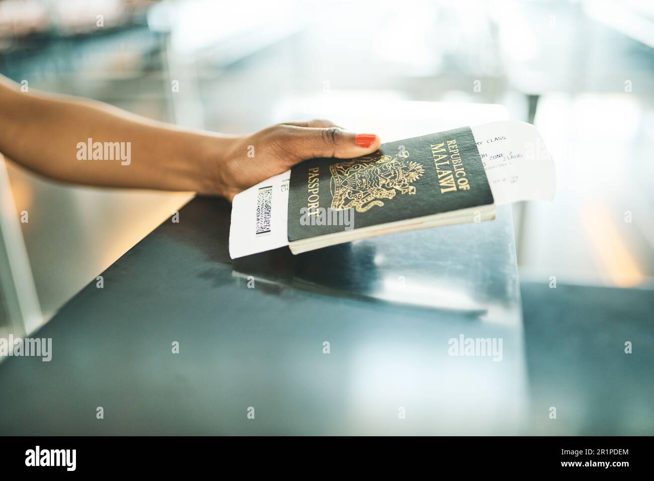 Hand, passport and airport service counter closeup or boarding flight ...