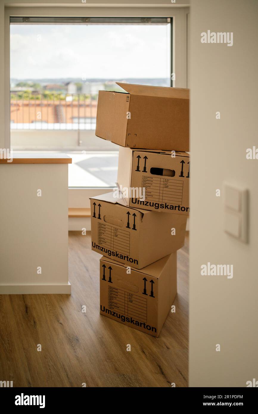 Moving boxes in the new apartment Stock Photo - Alamy