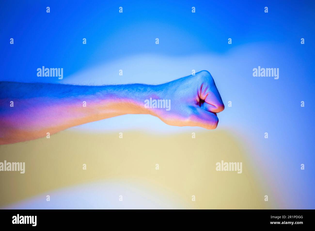 Fist in neon light Stock Photo - Alamy