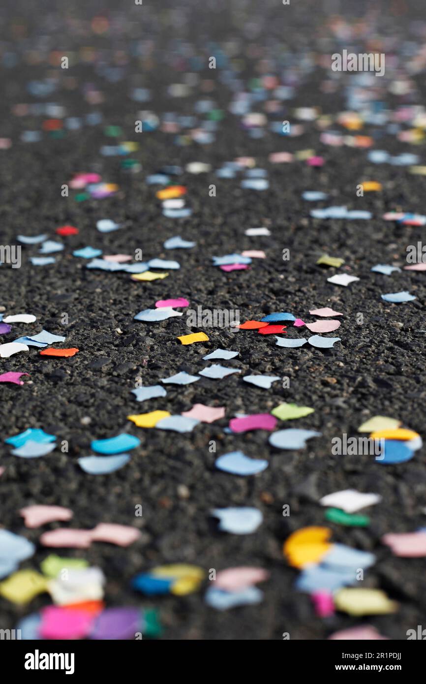 Confetti on the street Stock Photo - Alamy