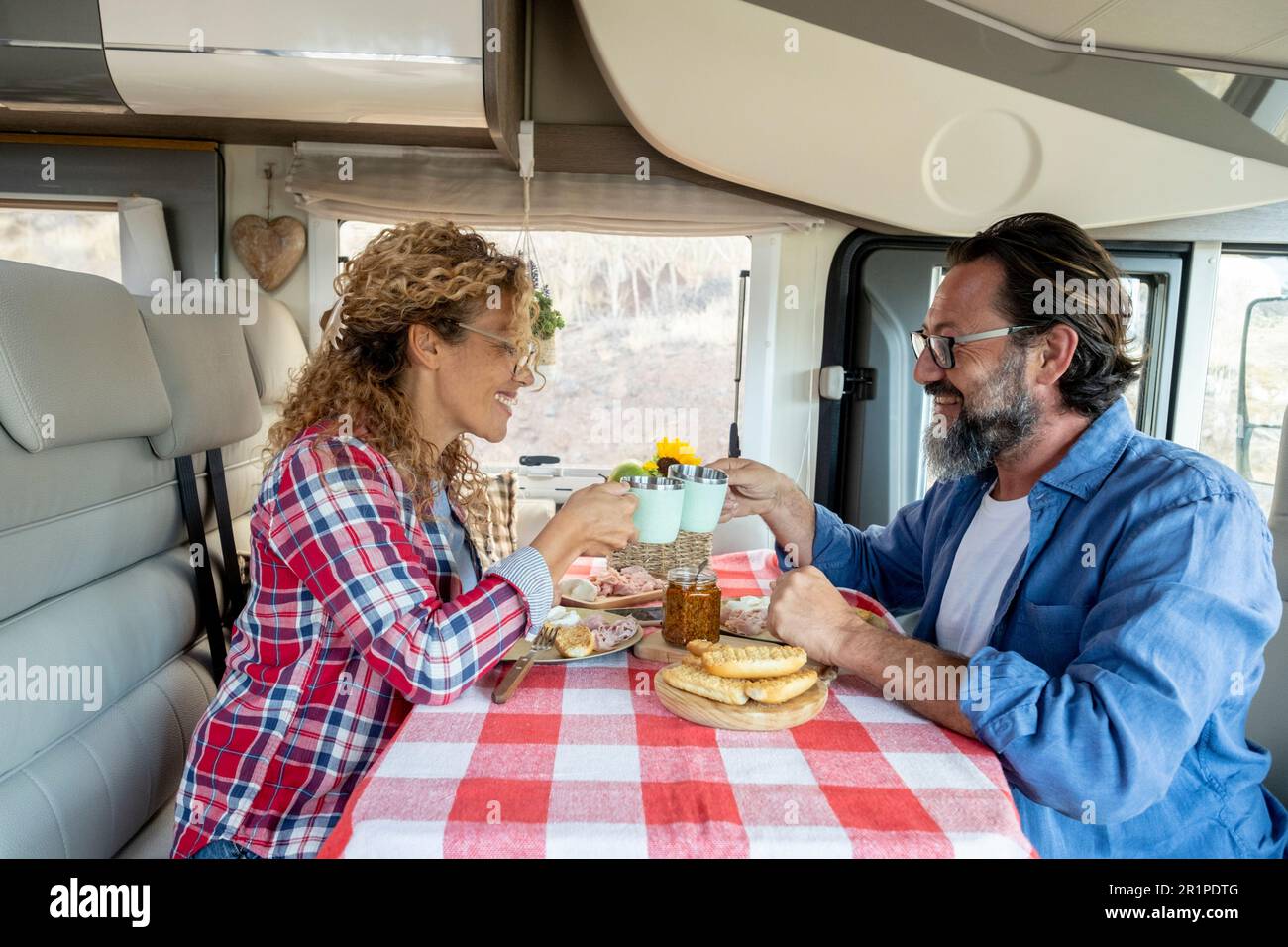 Travel, vacation, camper, couple, happy, breakfast Stock Photo - Alamy