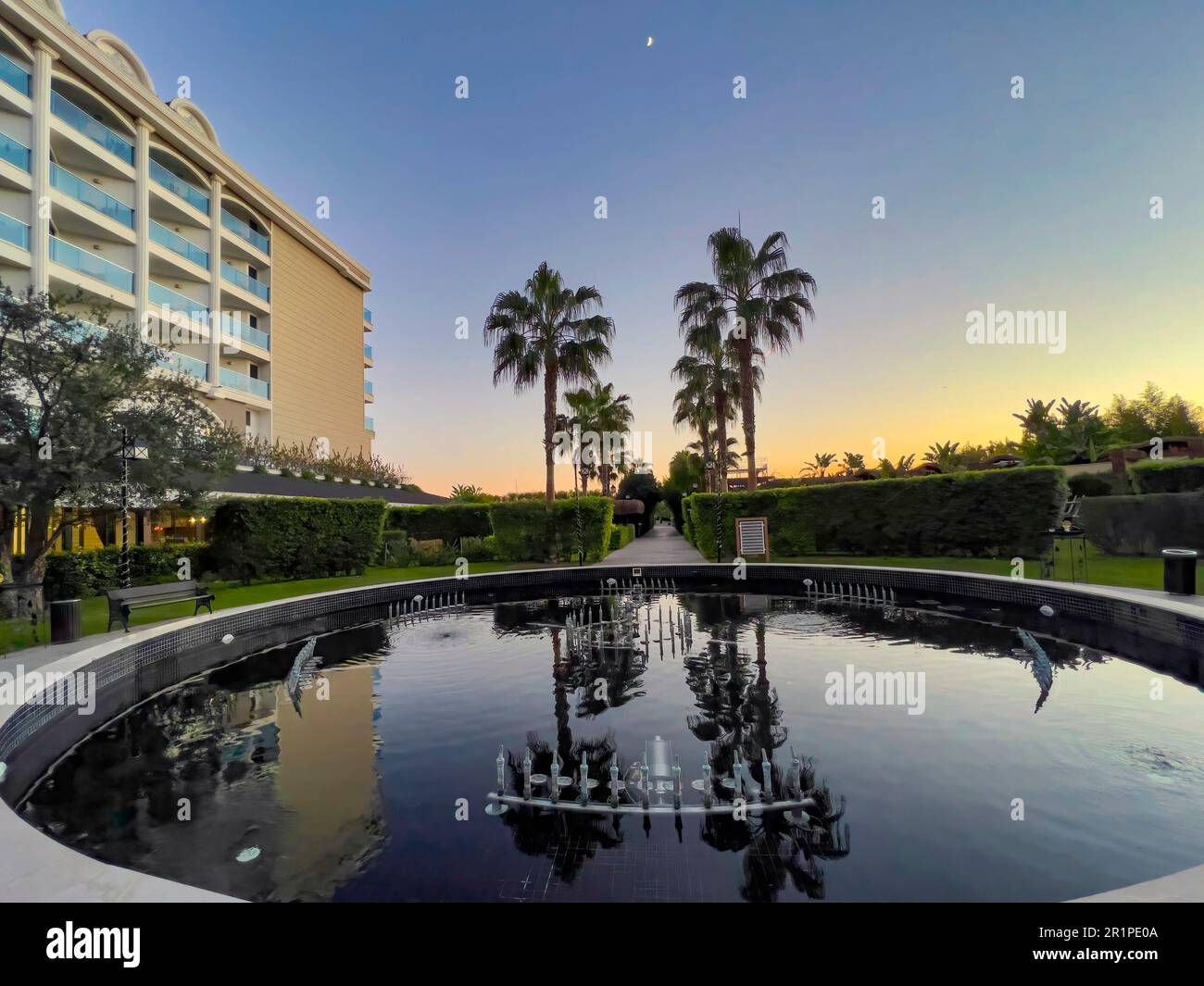 Palm trees, garden, hotel complex at Lara Beach, Lara, Antalya, Turkey ...