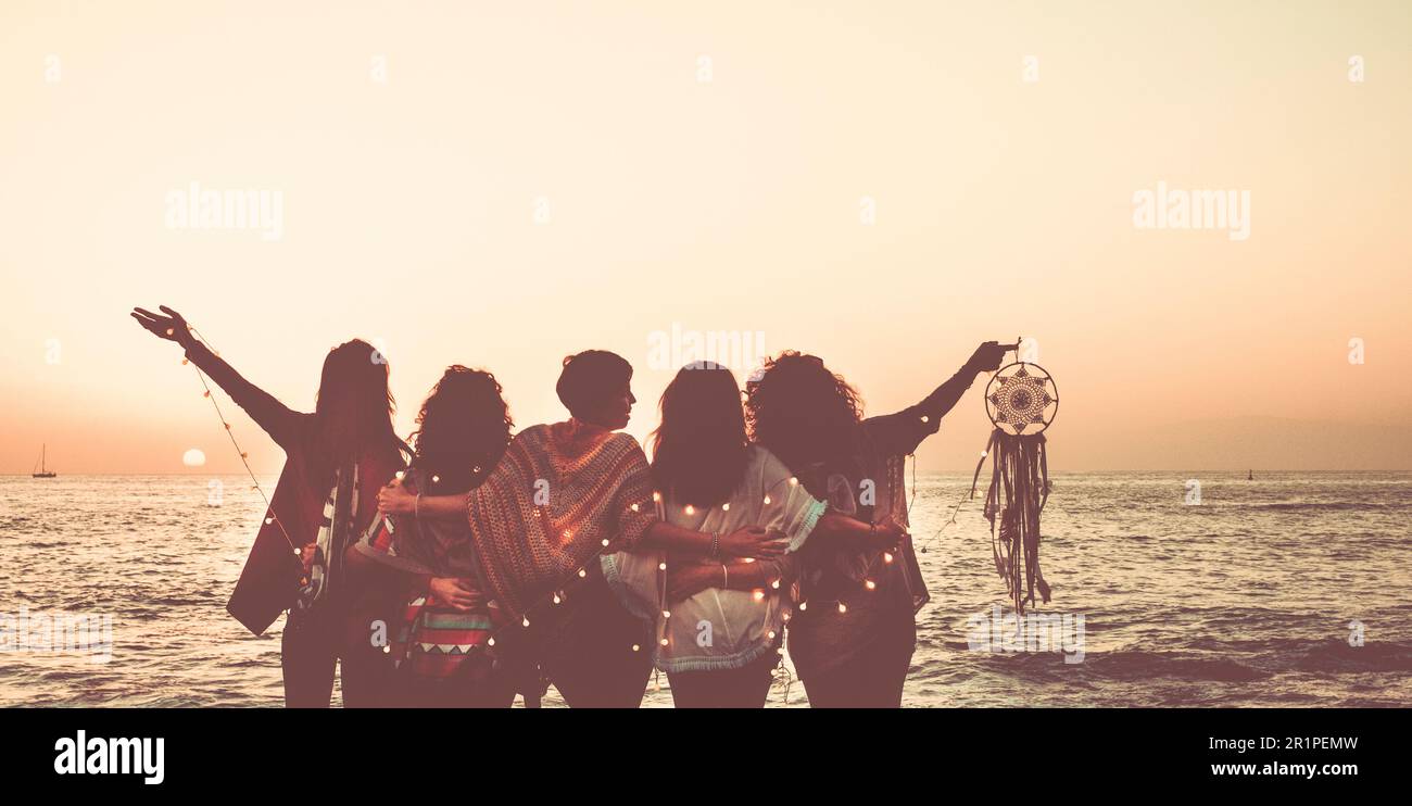 Group of friends hugging at the beach hi-res stock photography and ...