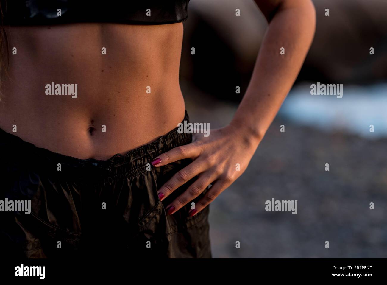 Close up of woman belly with abs abdominal and black sportswear ...