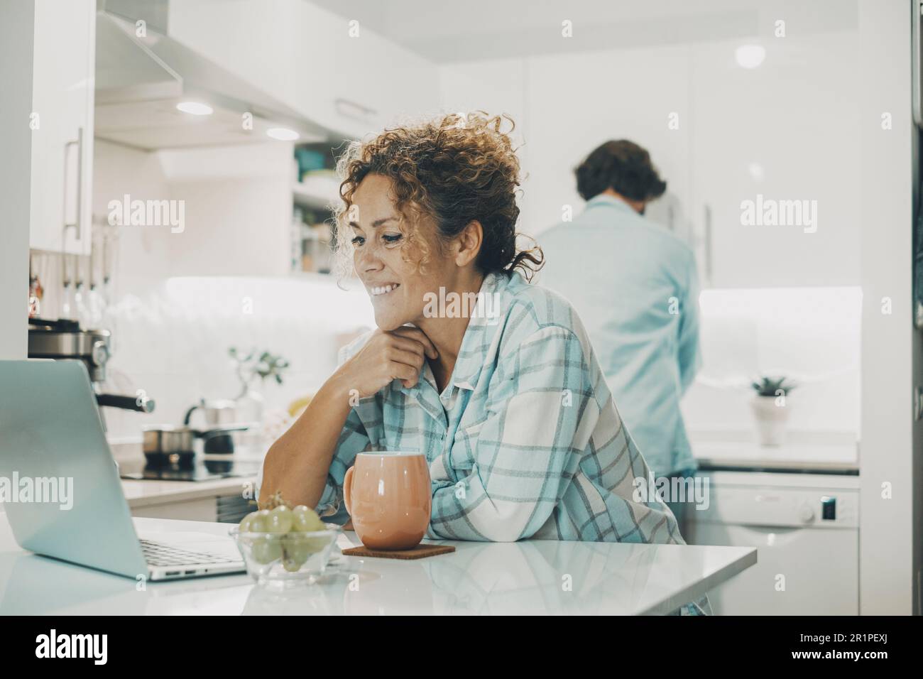 Woman watching man washing dishes hi-res stock photography and images ...