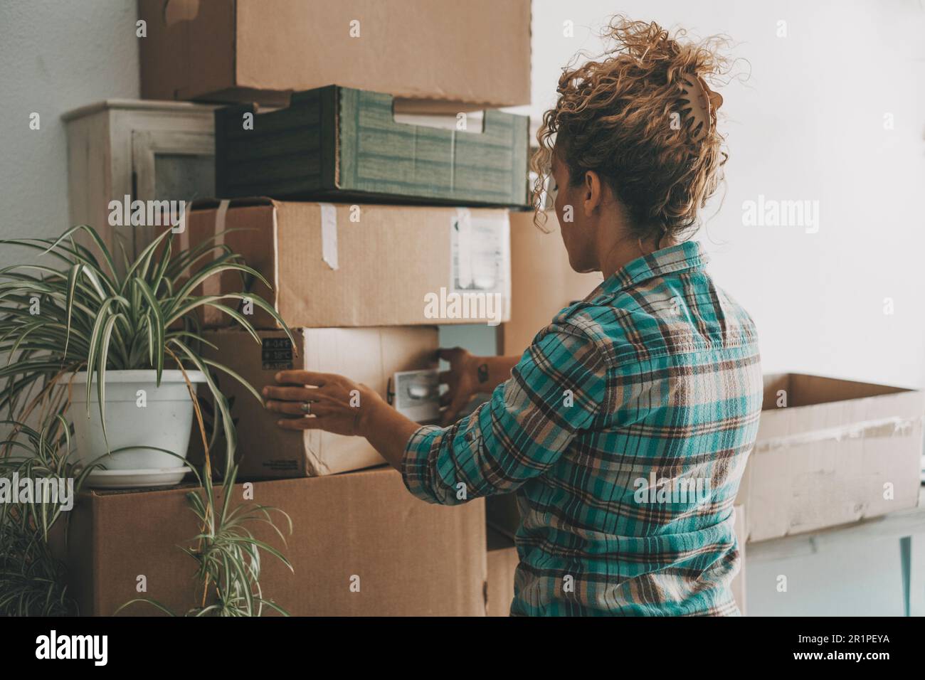 Independent lifestyle female people relocating house moving boxes ...