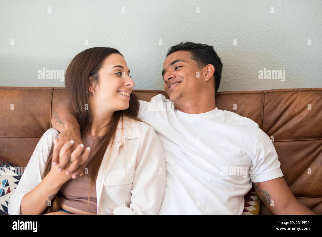 Husband and wife resting bonding at home enjoying weekend hi-res stock ...