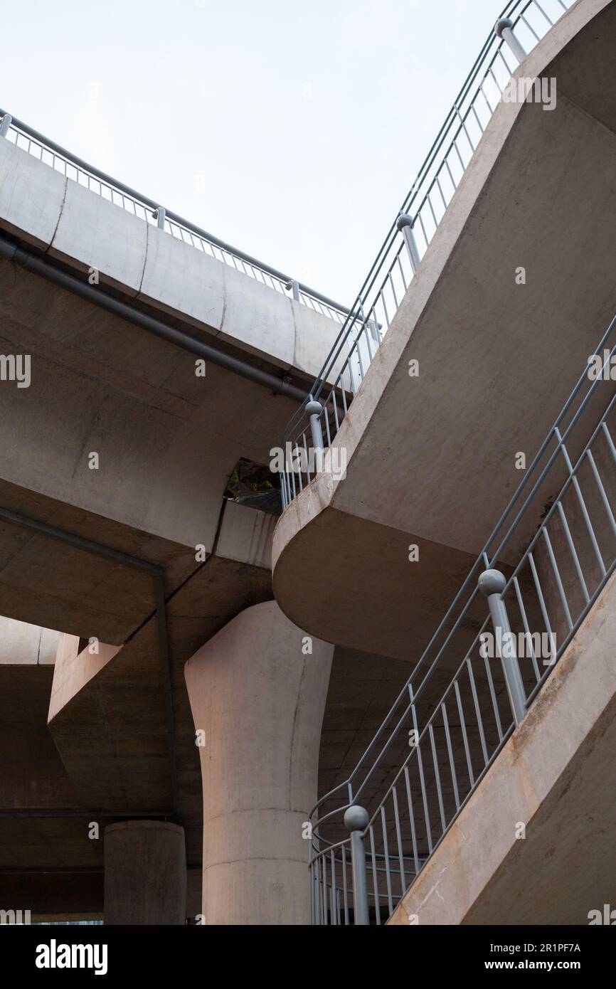 Low angle view of a staircase to a modern concrete bridge. Beautiful ...