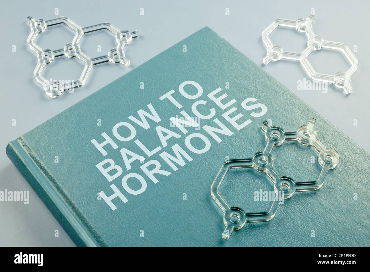 Book how to balance hormones and chemical models Stock Photo - Alamy