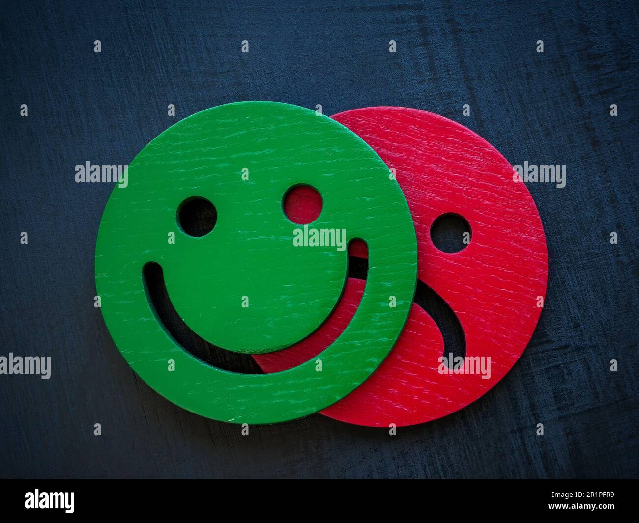 Happy emoticon on a sad. Emotional labor or mental health concept Stock ...