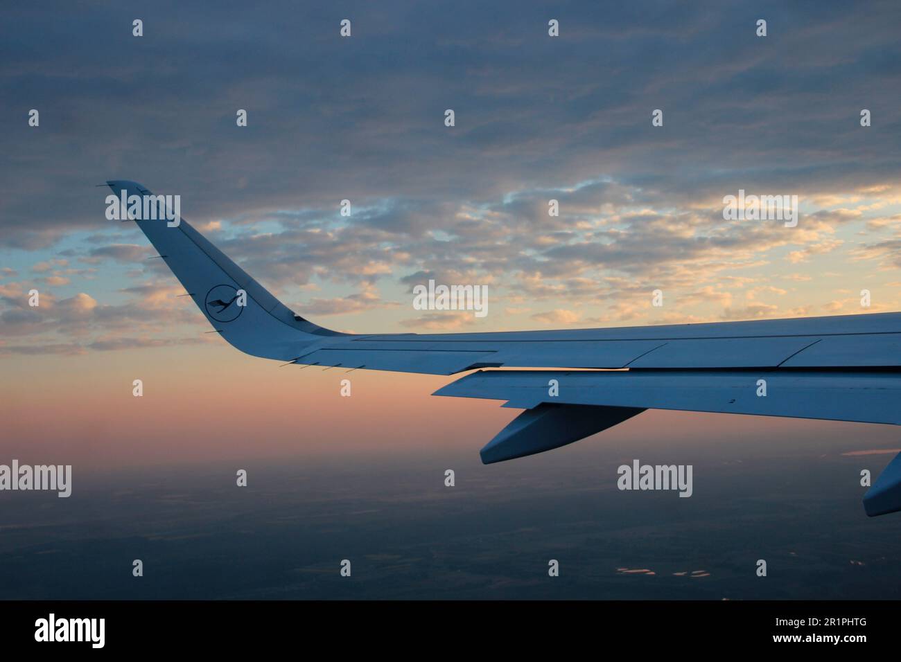 Airplane, view from window, during takeoff over Munich airport, horizon ...