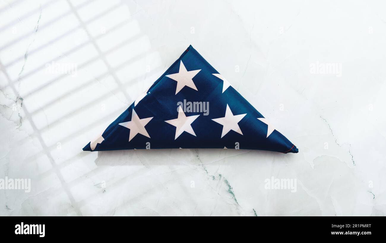 USA Flag Folded Into A Triangle Stock Photo - Alamy