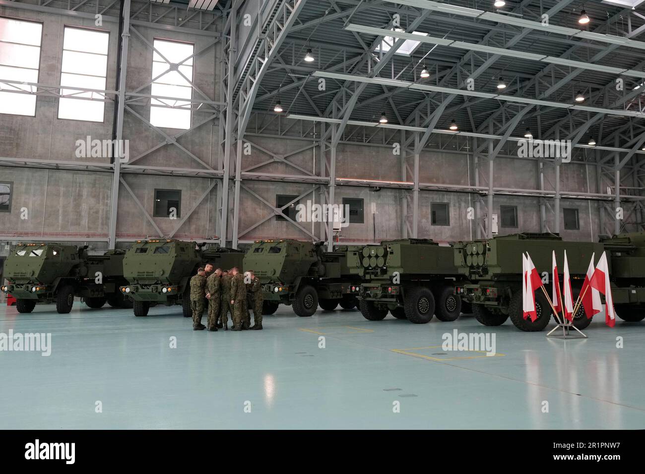 Polish soldiers stand by vehicles carrying U.S.-made HIMARS rocket ...