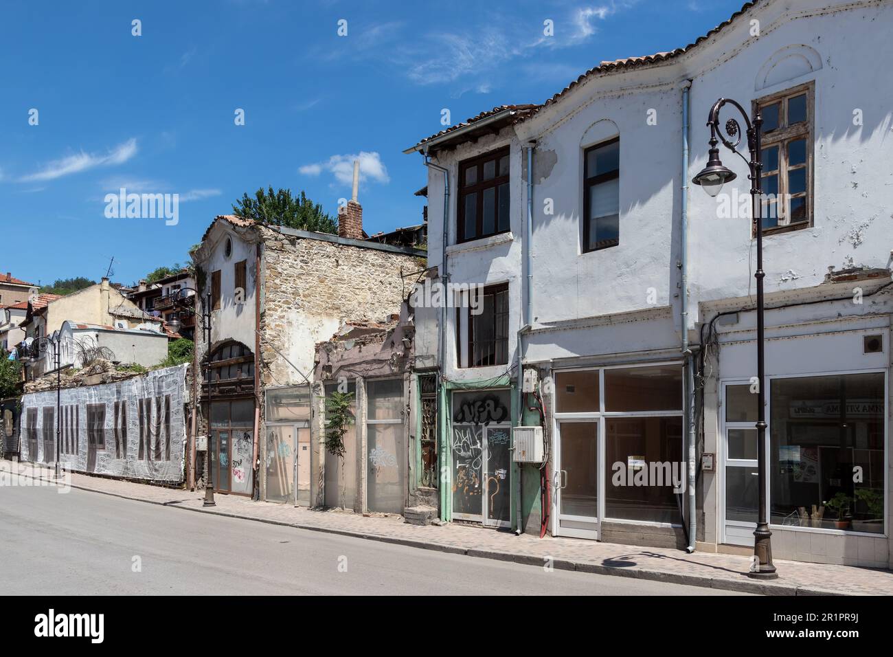 Run down and damaged buildings still showing signs of the decline in ...