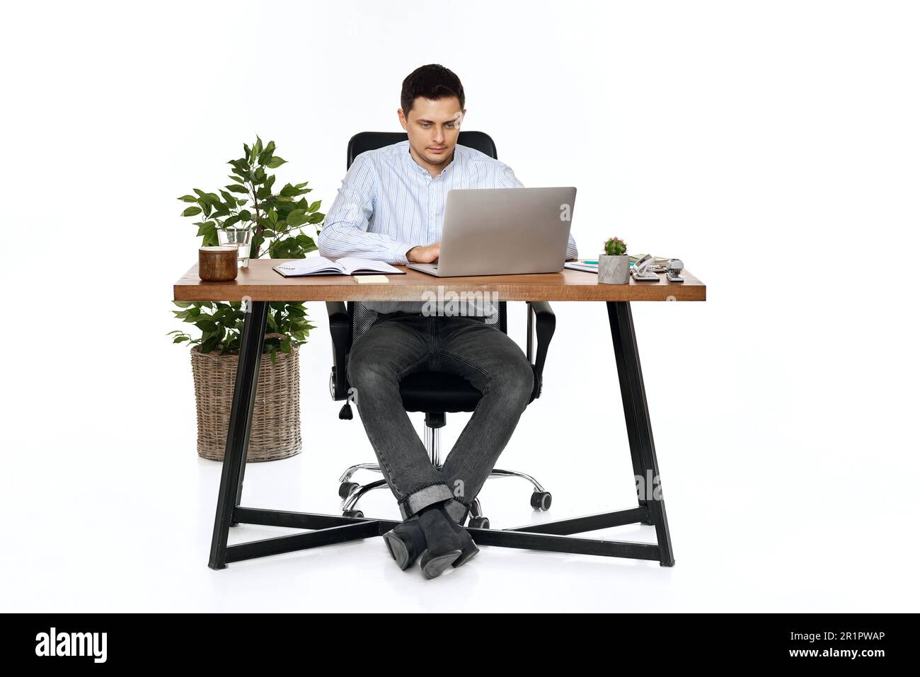 Smiling man sitting table using Cut Out Stock Images & Pictures - Alamy