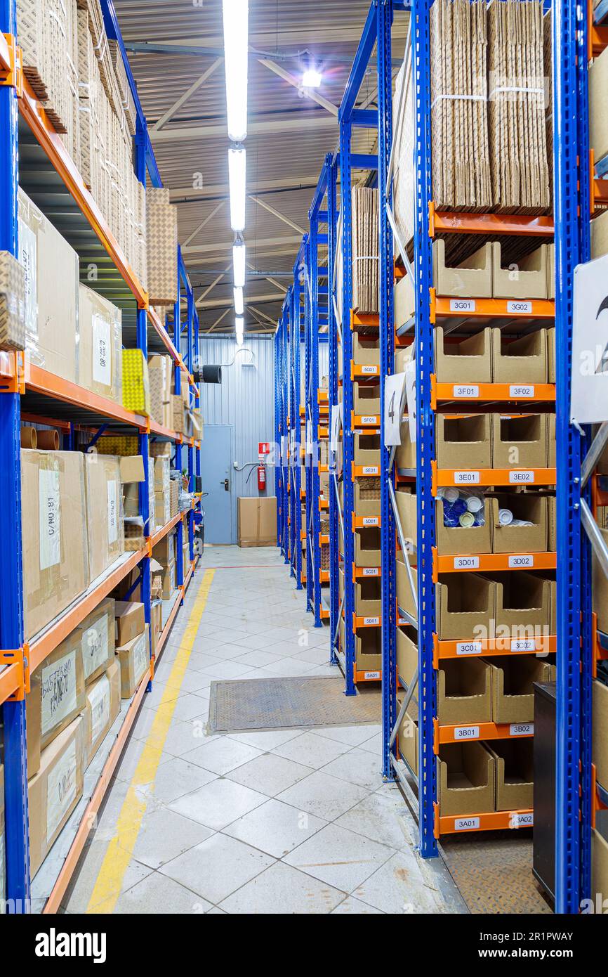 Empty shelving racks in new distribution warehouse hi-res stock ...