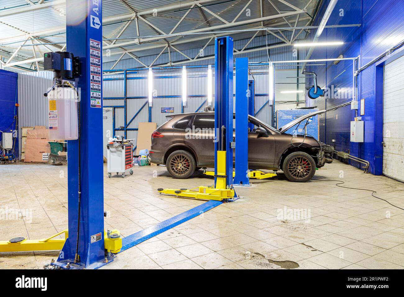 Hydraulic lift for cars in the workshop. High quality photo Stock Photo ...
