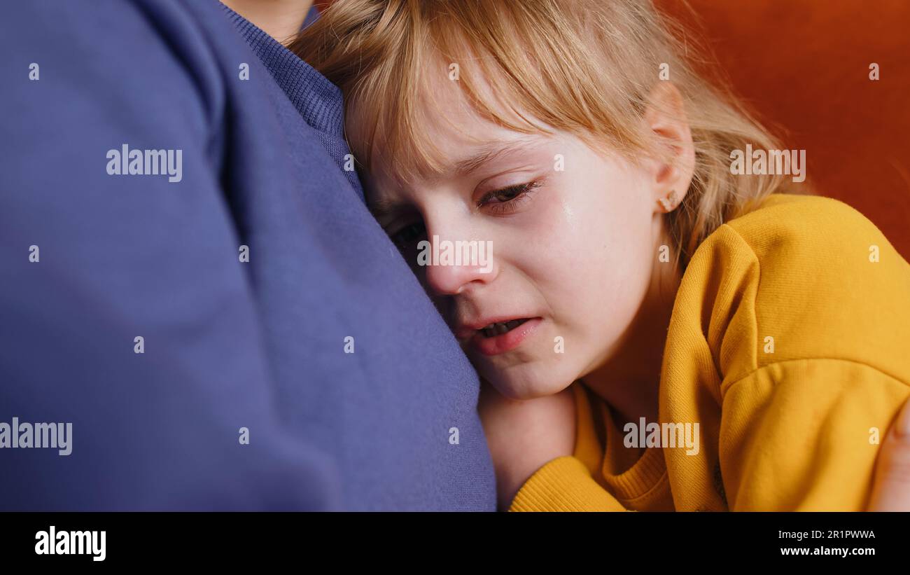 Close-up portrait of upset child little girl kid crying with tears ...