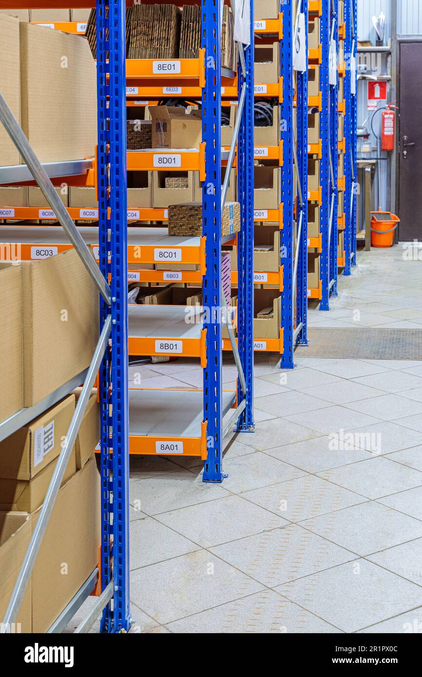Empty shelving racks in new distribution warehouse hi-res stock ...