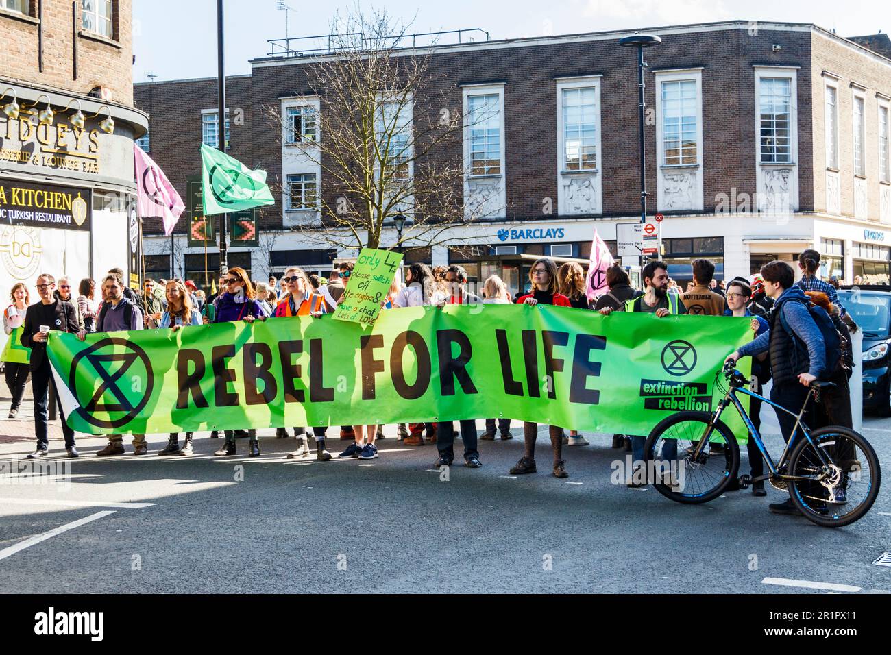Extinction Rebellion protesters stop traffic in a London high street ...