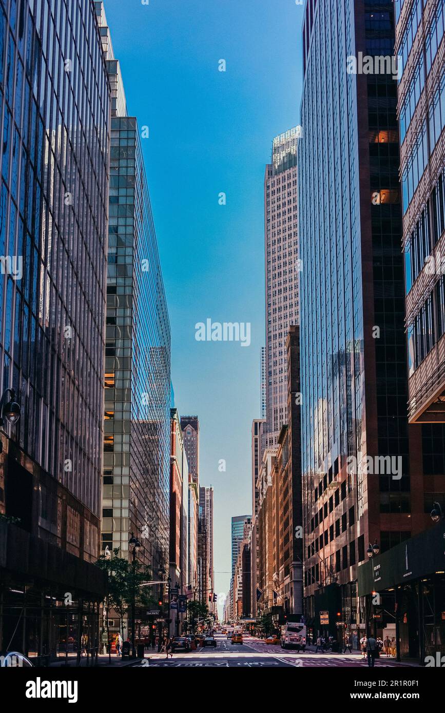View into a canyon of houses in Manhattan with modern skyscrapers to ...