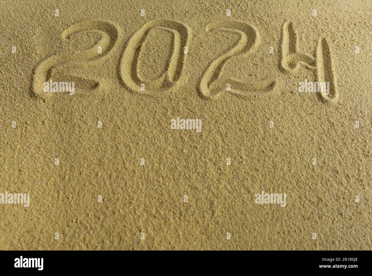 Numbers 2024 on the sea sand Stock Photo - Alamy