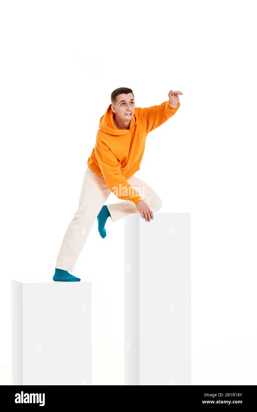 man rising up the career ladder. guy following up on white diagram ...