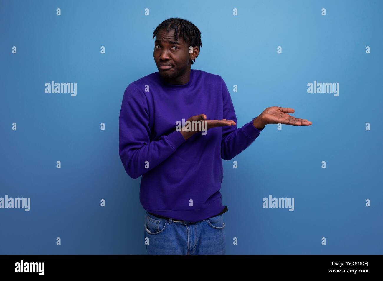 emotional thinking black american young man with dreadlocks in casual ...