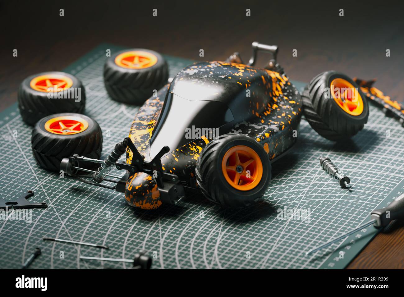 Disassembled remote-controlled car laying on a cutting mat. Desk in a ...