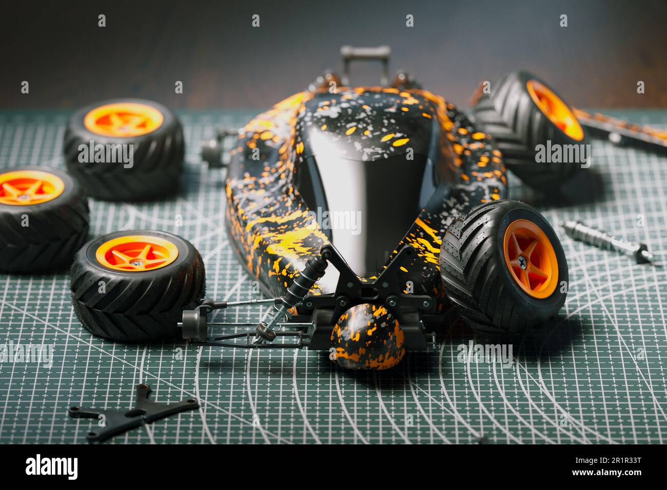 Disassembled remote-controlled car laying on a cutting mat. Desk in a ...
