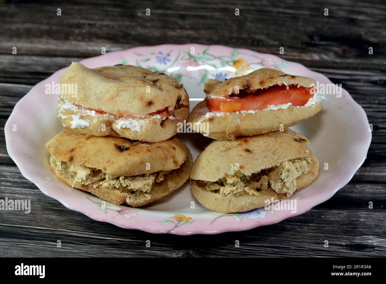 Sandwiches of Feta white cheese with slices of tomatoes and Traditional ...