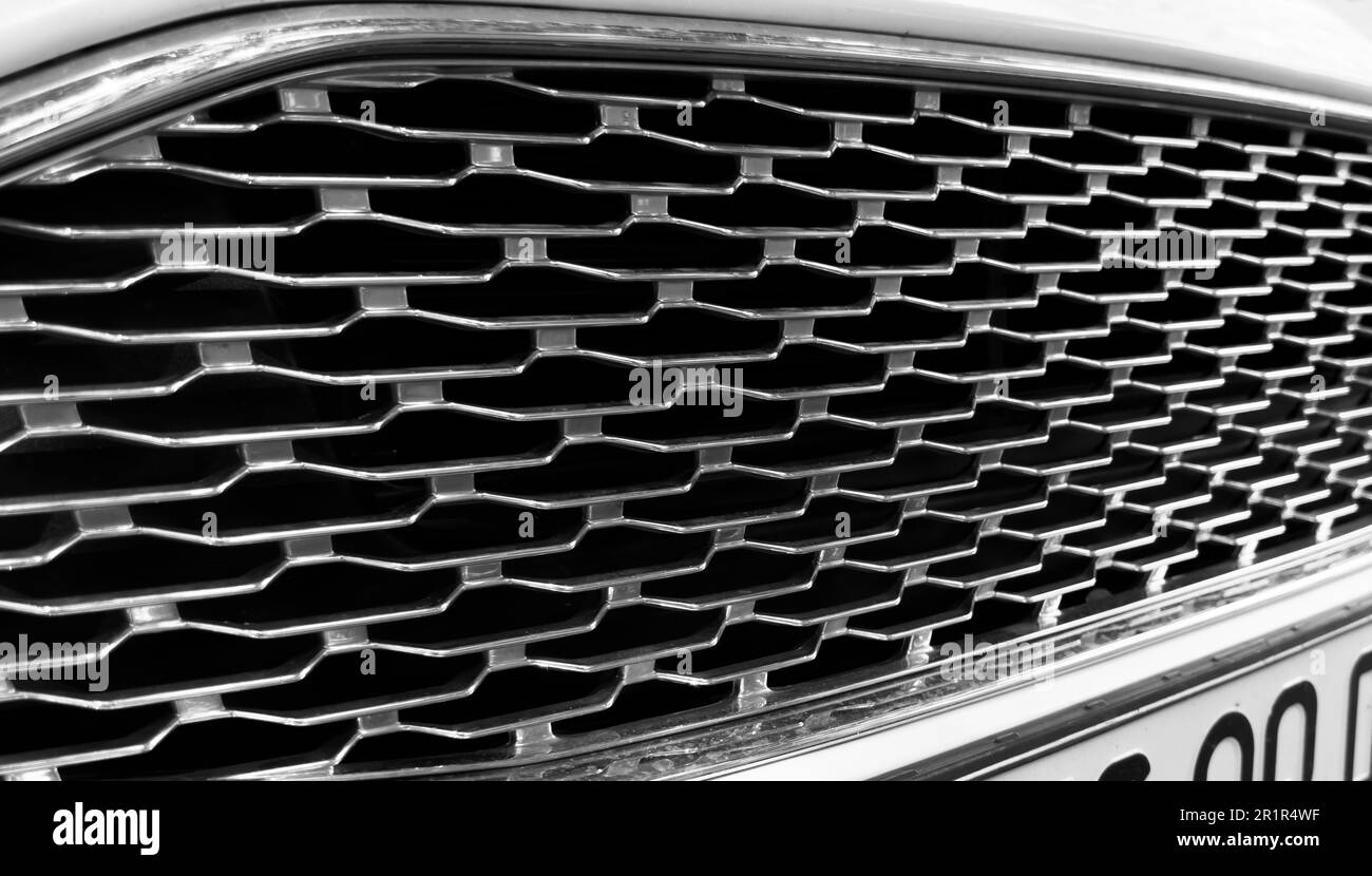 Radiator grille pattern. Car radiator grill close up. Chrome grill of big powerful car engine ...