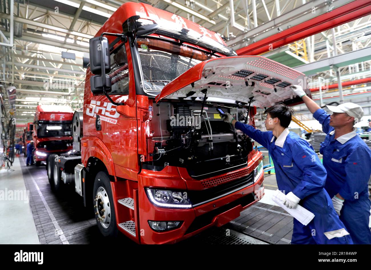 QINGDAO, CHINA - MAY 15, 2023 - Workers test vehicles that are about to ...