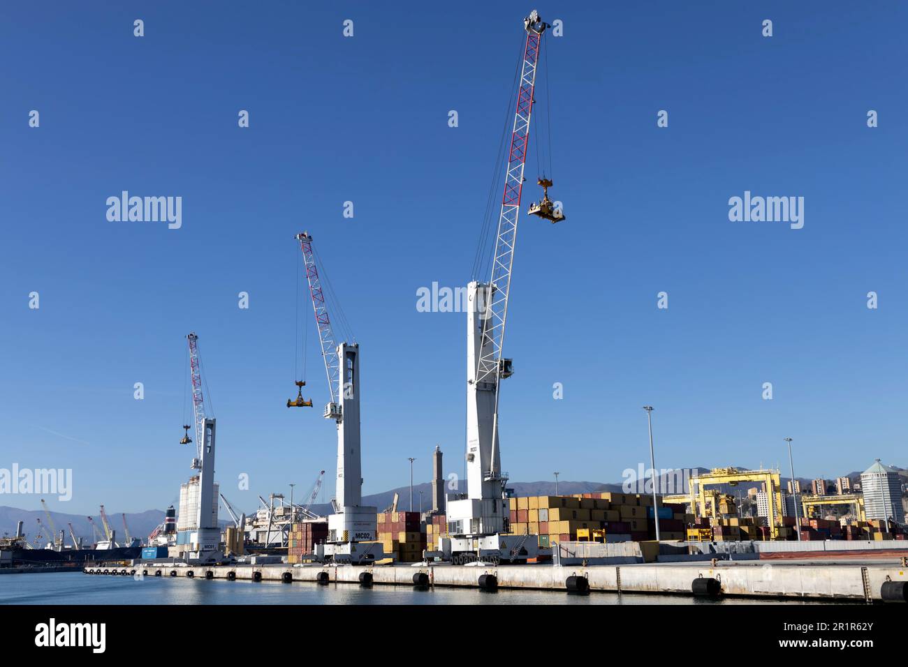 GENOA, ITALY, FEBRUARY 2, 2023 - Three industrial cranes for containers ...