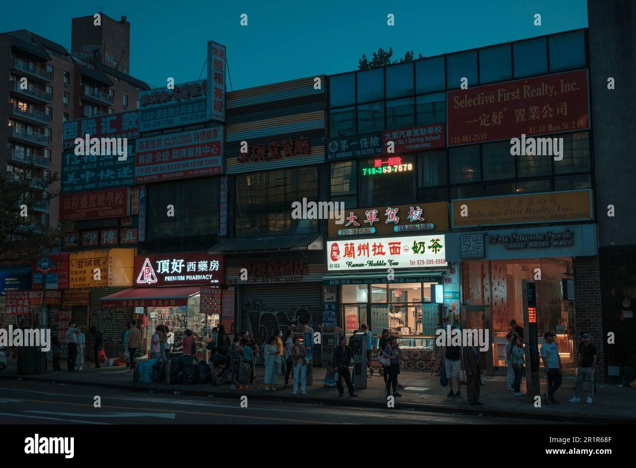 Street scene at night in Flushing, Queens, New York City Stock Photo ...