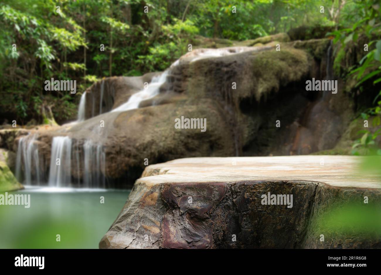 Wood table top podium floor in outdoor waterfall green tropical forest nature background.Natural ...