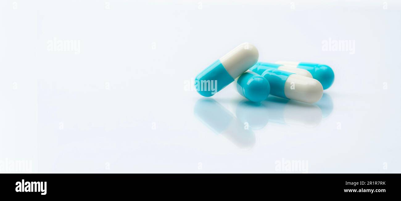 Blue-white capsule pills on white background. Pharmacy banner ...