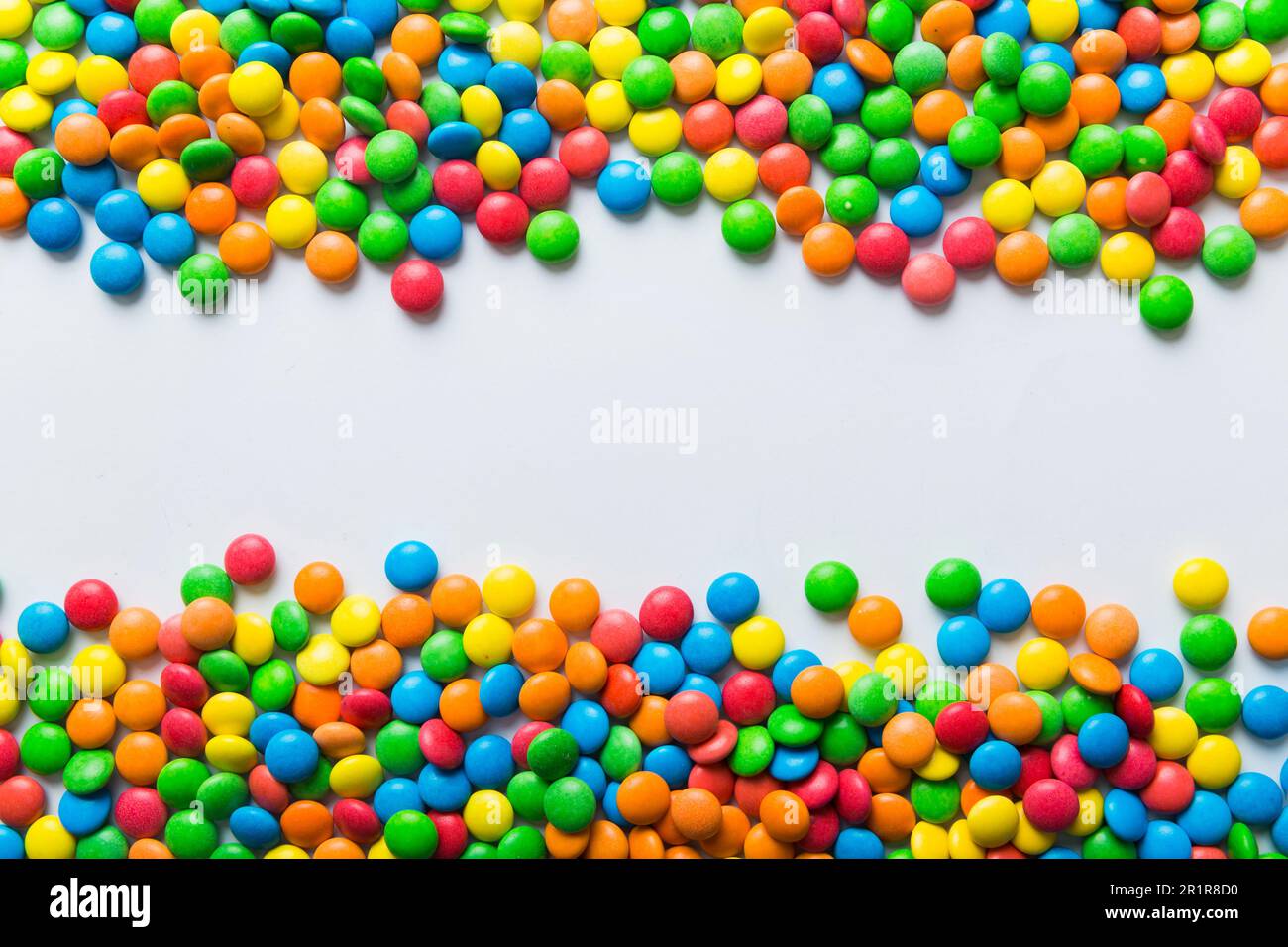 Mixed collection of colorful candy, on colored background. Flat lay ...