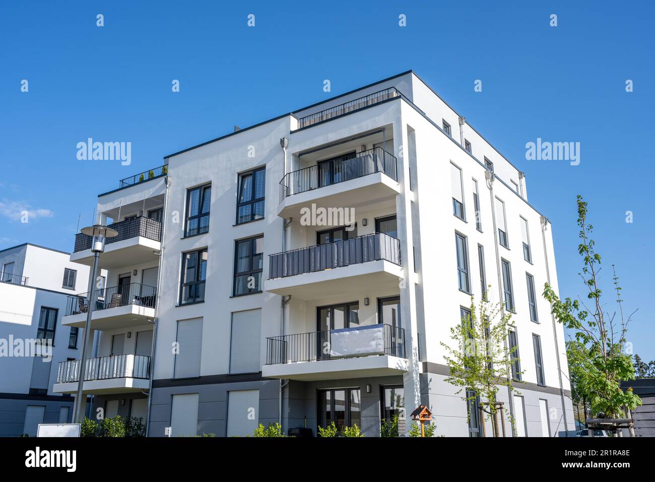 New white apartment building with balconies seen in Berlin, Germany ...