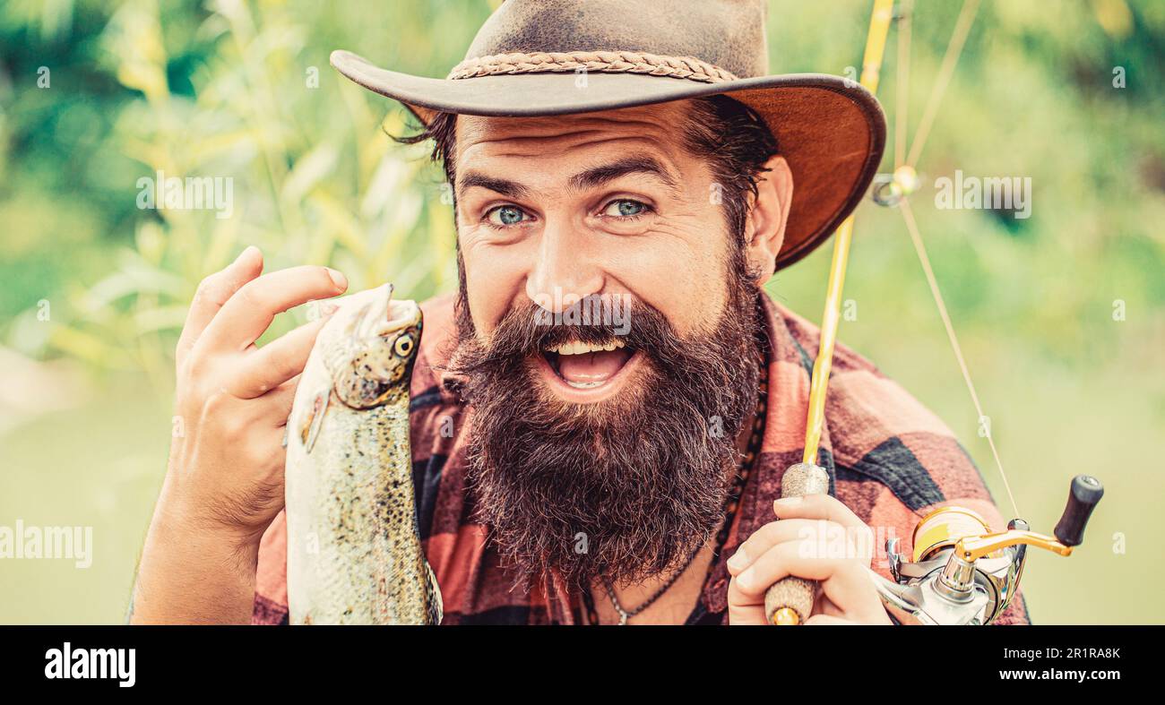 Man holding a trout fish. Fishing. Angler with fishing trophy ...