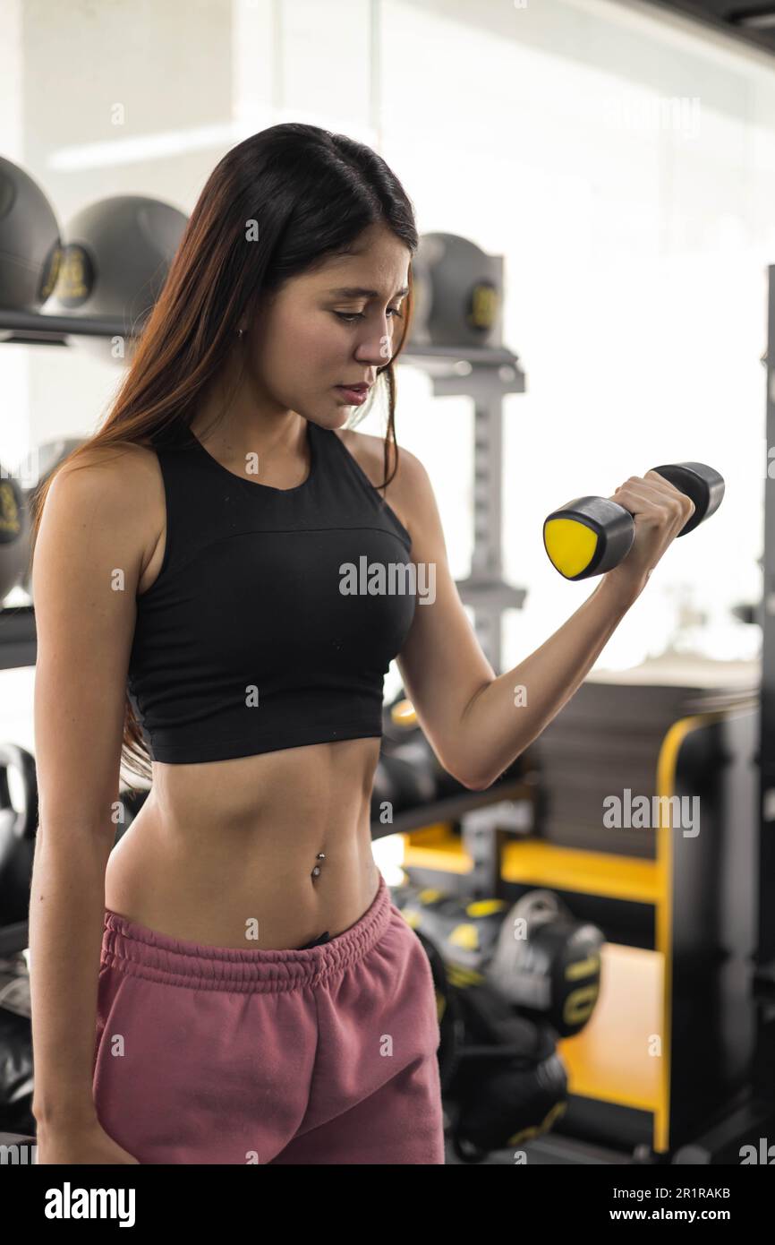 strengthening arm muscles with dumbbells, physical training of fitness ...