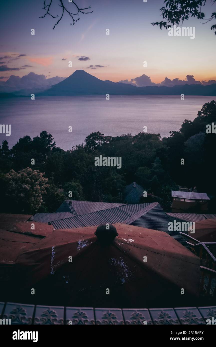 An aerial view of Guatemala's Lake Atitlan surrounded by three volcanic ...