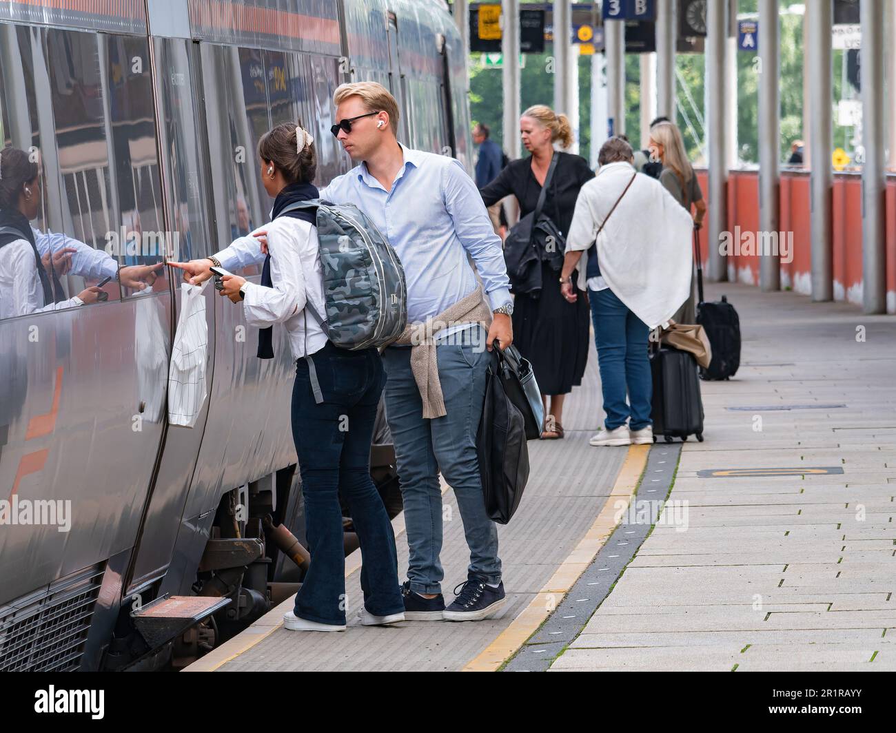 Passengers boarding the Airport Express, Flytoget, at Lysaker Station ...