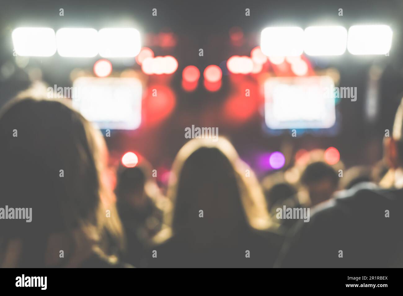 Picture with silhouette of people at a music concert. Crowd at festival ...