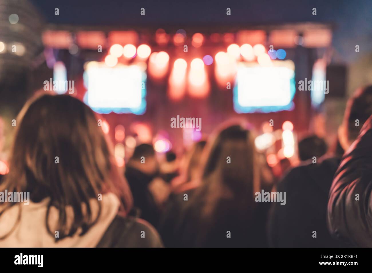 Picture with silhouette of people at a music concert. Crowd at festival ...