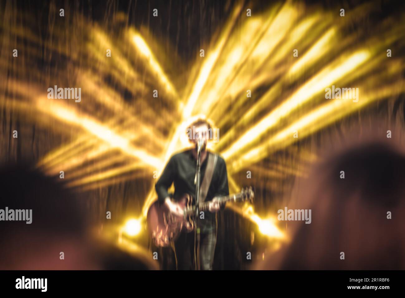 Unknown singer on the stage at a concert. Stage lights at a music ...