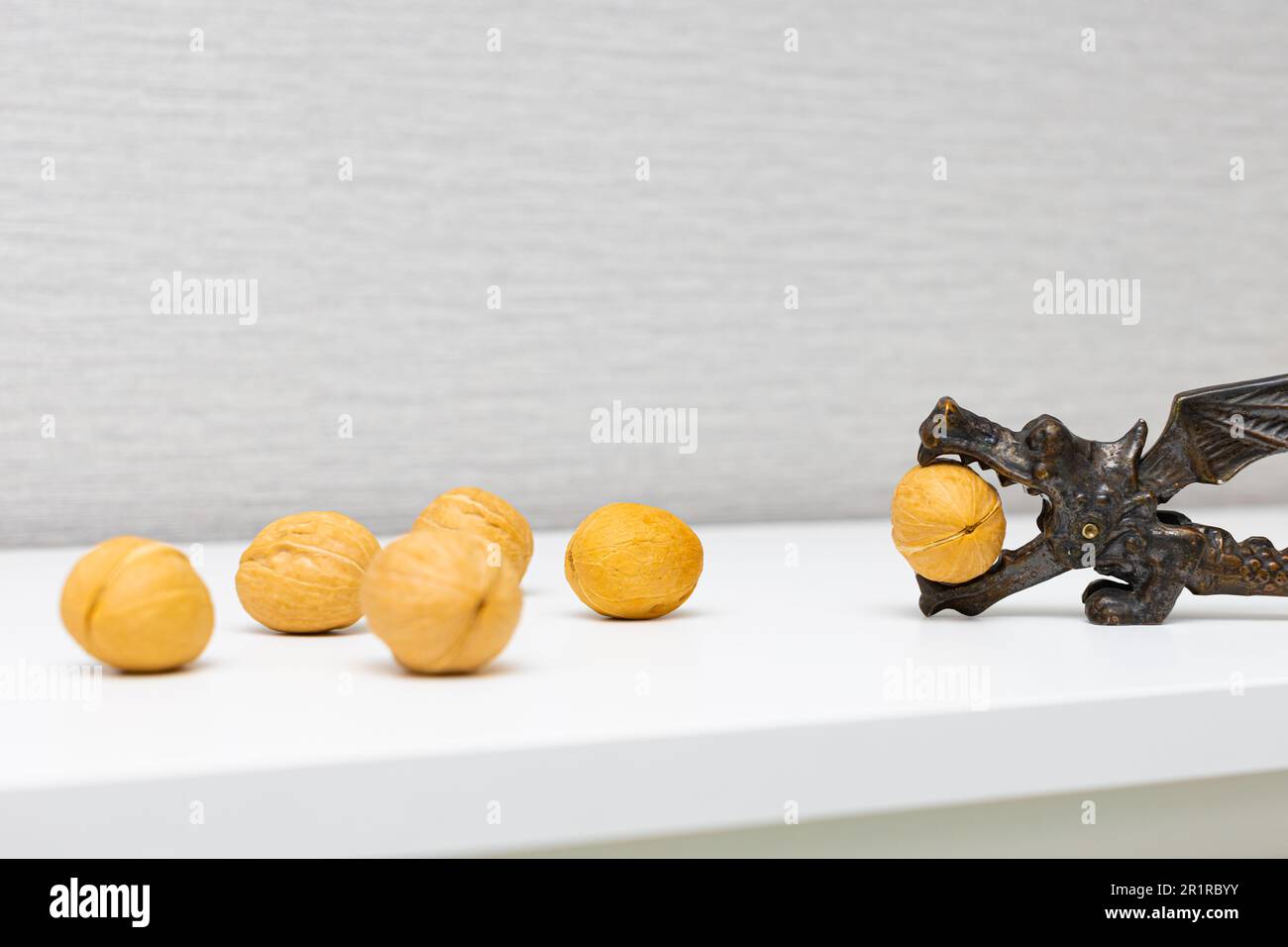 manual nut cracker for walnuts lies on the table. walnut tongs ...