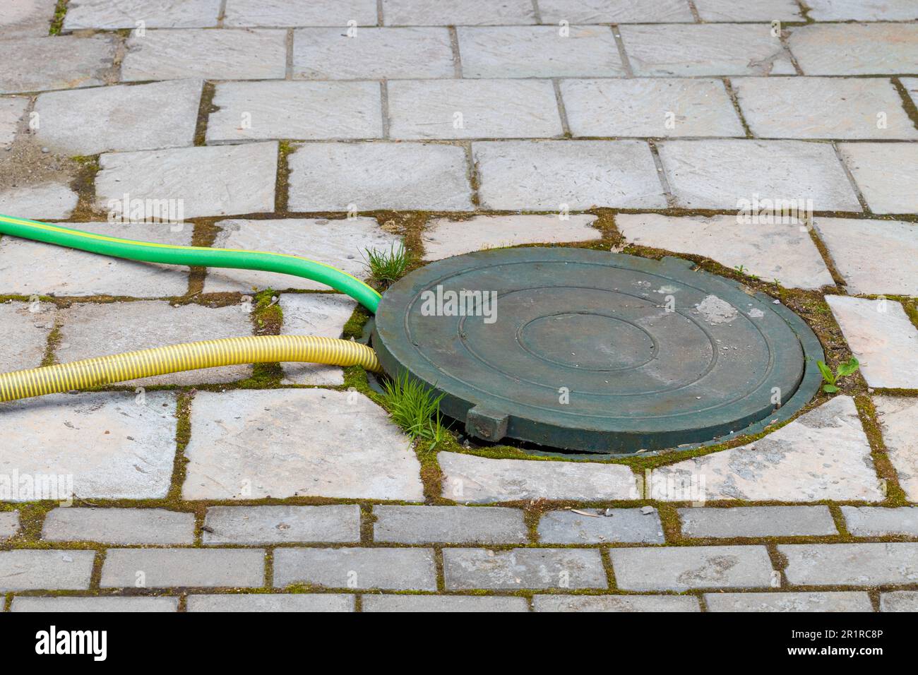 open sewer manhole on a city street. city sewer cleaning Stock Photo ...