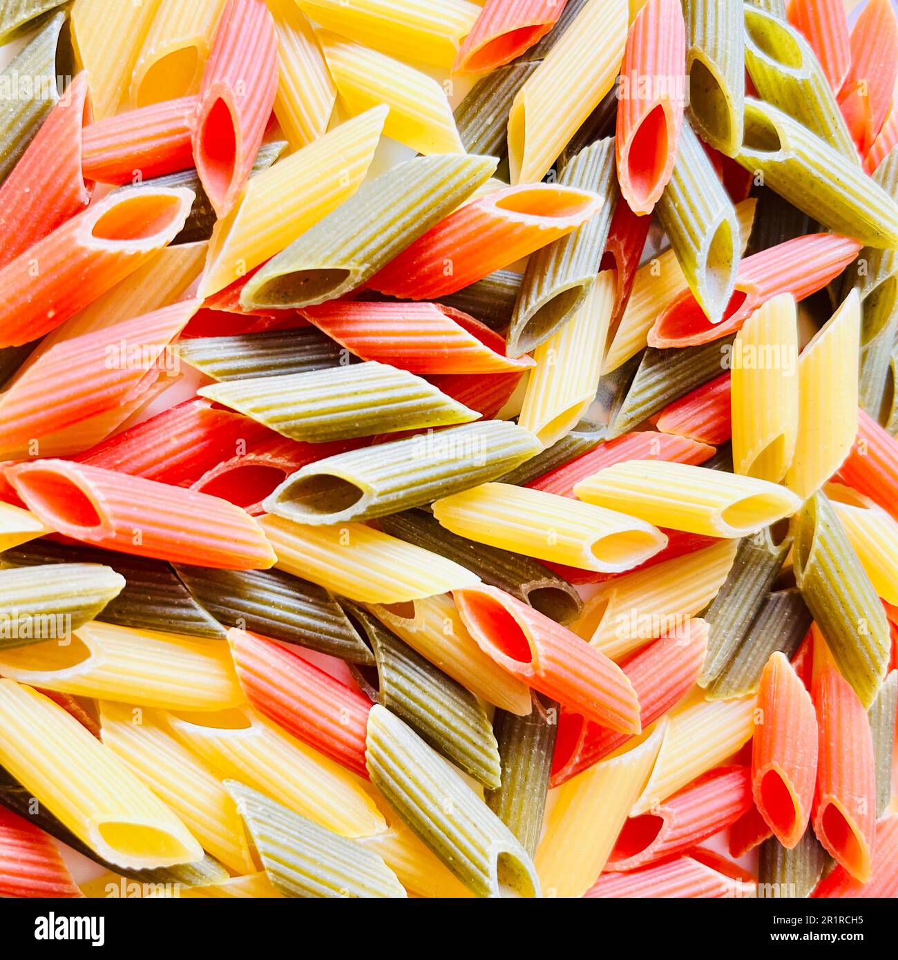 Full frame close-up of raw tricolore penne pasta Stock Photo - Alamy